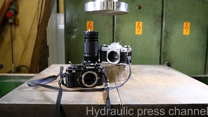 Nikon and Canon put to the ultimate durability test in a hydraulic press