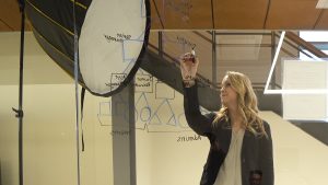 How to eliminate reflections on glass when shooting with flash