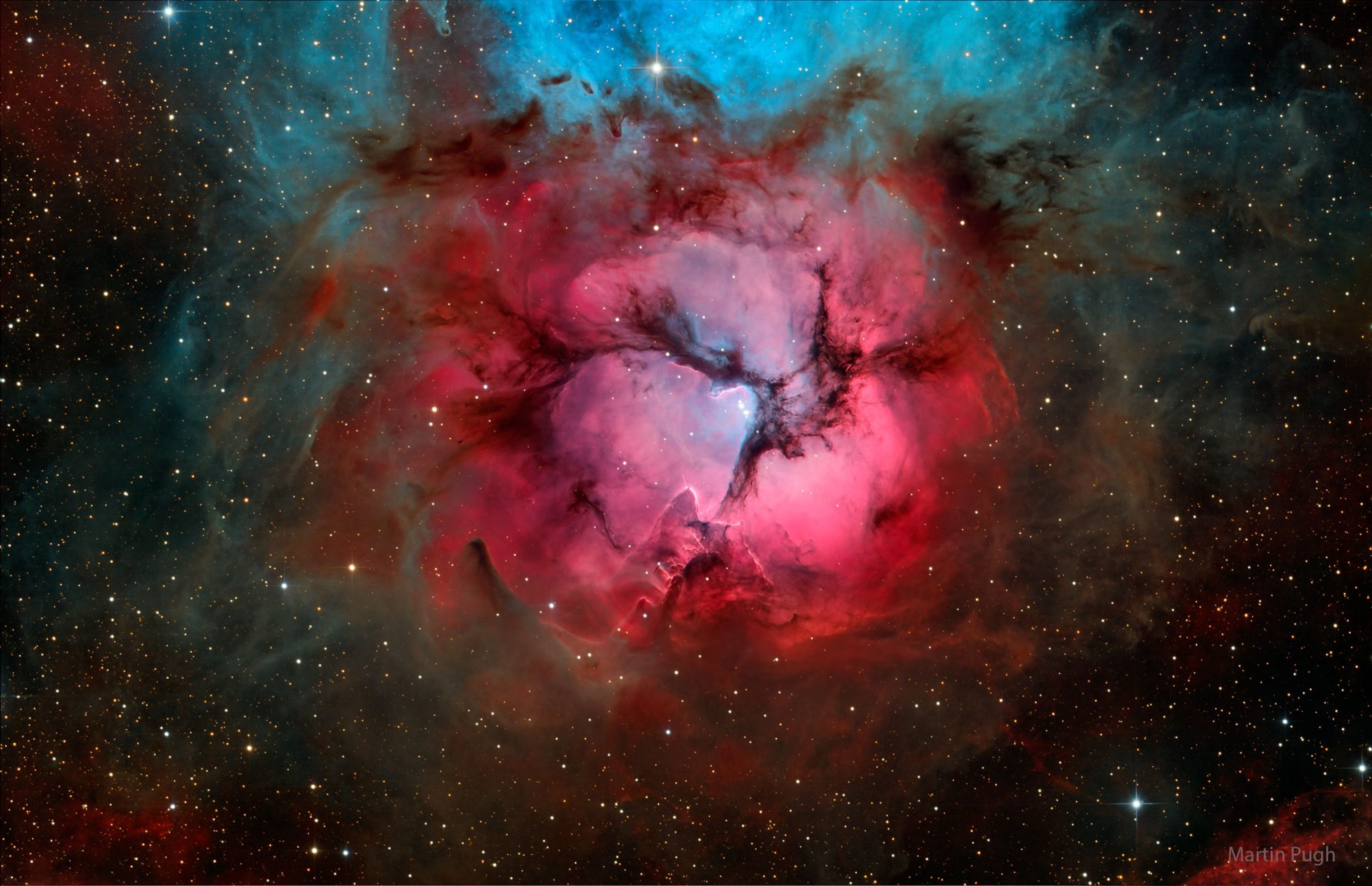 Feast your eyes on this colorful stellar fireworks of the Trifid Nebula